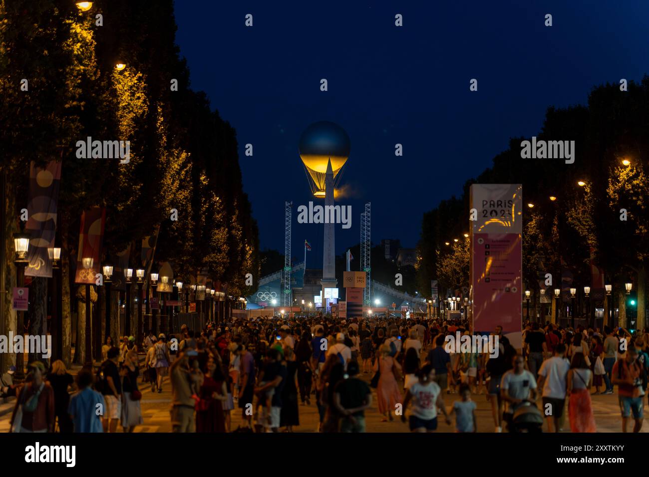 Paris, France - Aug 10, 2024: Crowds capture takeoff of Olympic Flame ...
