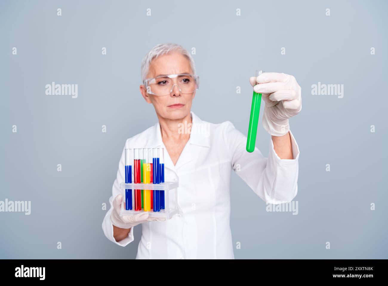Photo of specialist woman scientist hold analyze test tube lquid ...