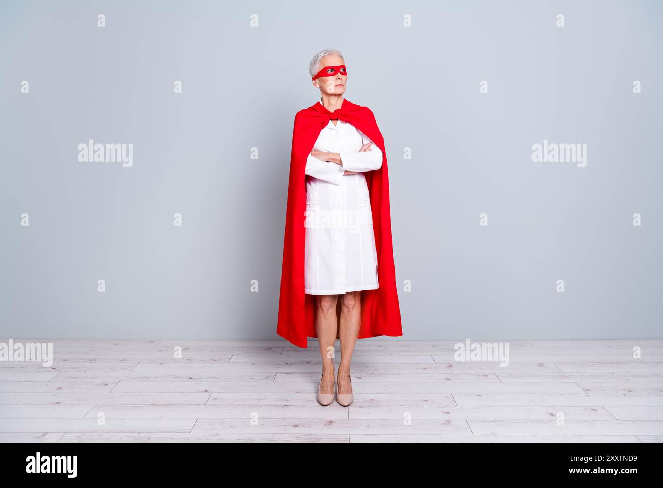 Photo of serious old lady doctor look empty space with crossed hands ...