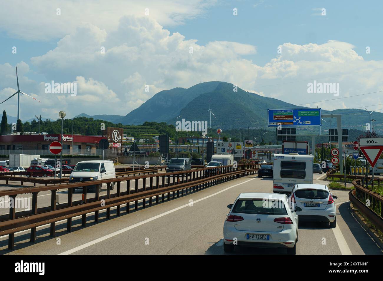 Progni, Italy - June 8, 2023: Vehicles navigate a bustling highway ...