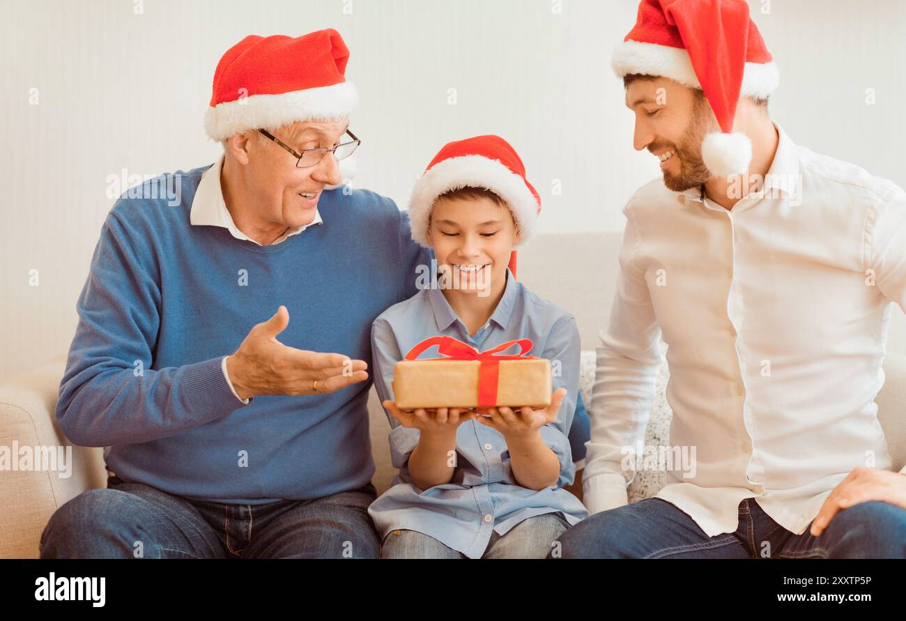 Child receive gift from grandparent hi-res stock photography and images ...