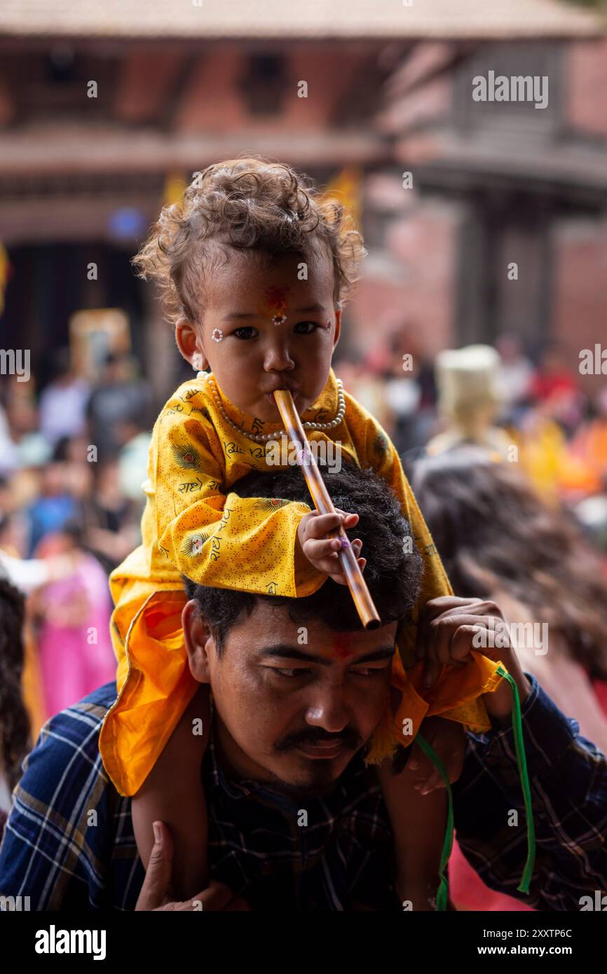 Lalitpur, Nepal. 26th Aug, 2024. A boy dressed as Lord Krishna is ...