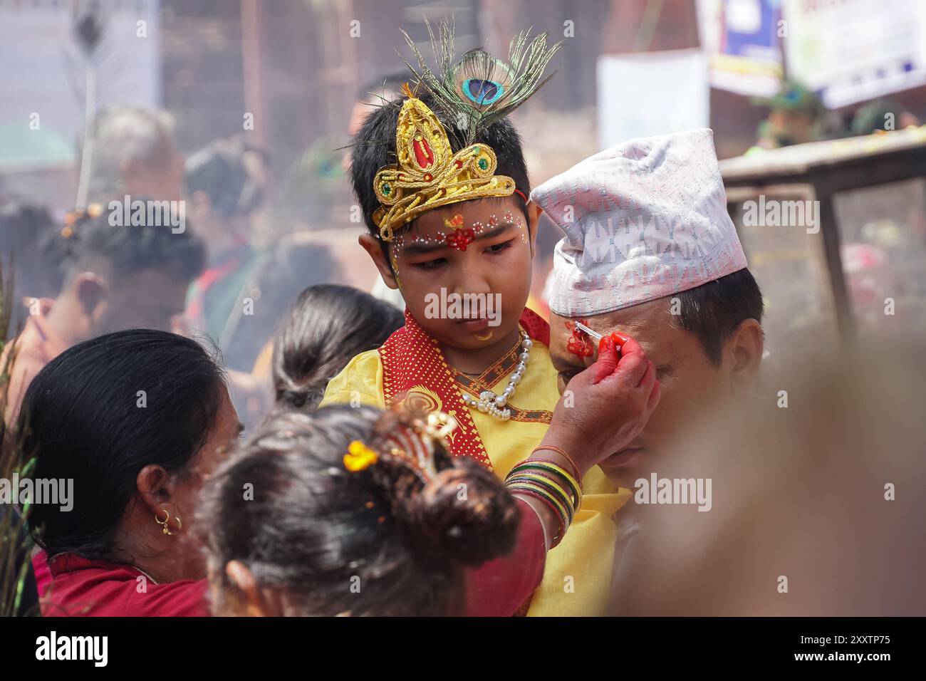 Lalitpur, Nepal. 26th Aug, 2024. A boy dressed as Lord Krishna is ...
