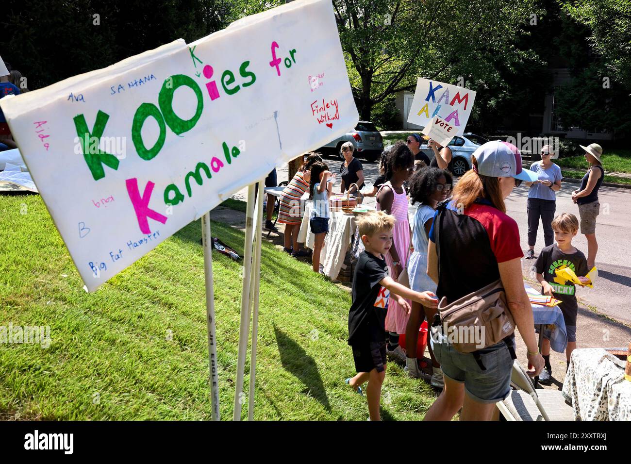Kids hold a "Kookies for Kamala" cookie bake sale fundraiser for the ...