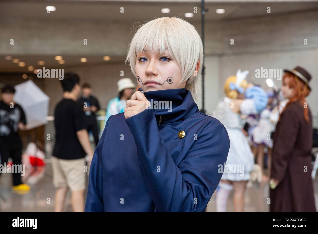 A cosplayer dressed as Toge Inumaki from the Jujutsu Kaisen manga is at ...