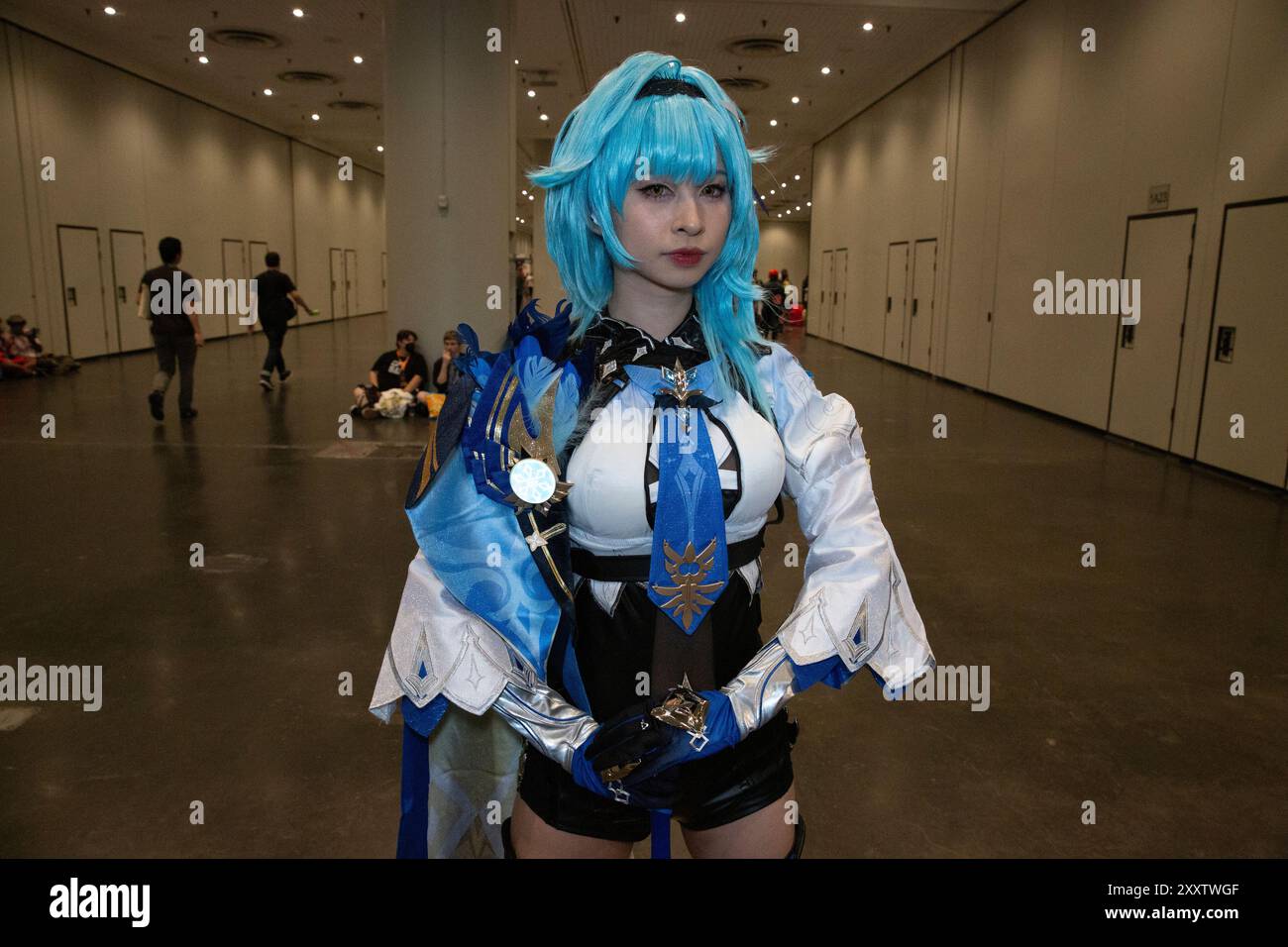 A cosplayer dressed as a character from the Genshin Impact video game ...