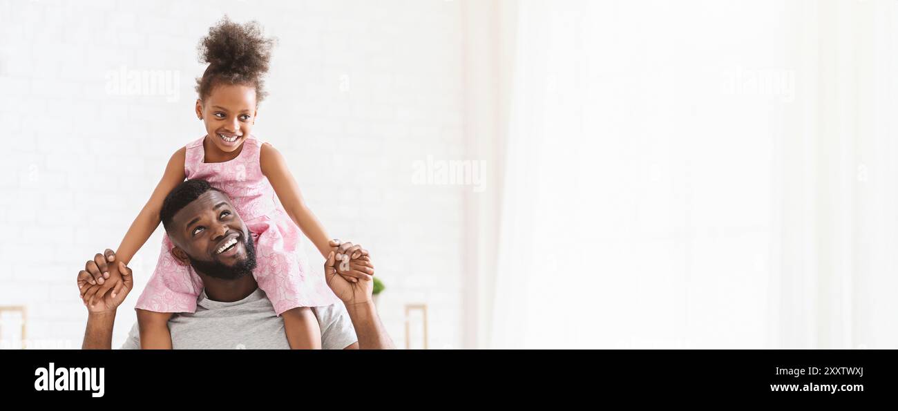 Father and Daughter Laughing Together in Living Room During Playtime ...
