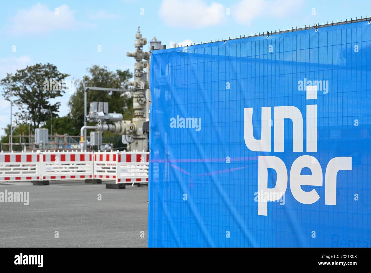 26 August 2024, Lower Saxony, Krummhörn: A fence bearing the logo of ...