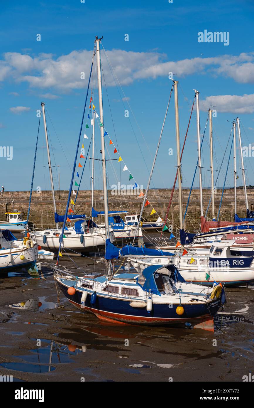 EDINBURGH - JULY 28, 2024: Several sailboats decorated with flags rest ...