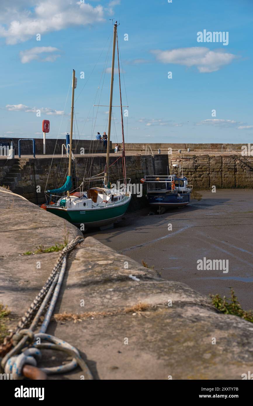 EDINBURGH - JULY 28, 2024: Two boats are tied up in a serene Fisherrow ...