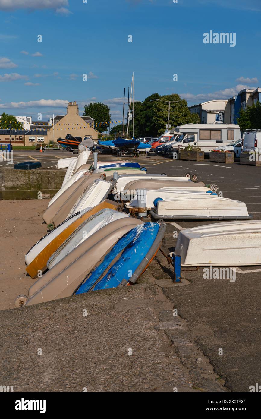 EDINBURGH - JULY 28, 2024: A row of white dinghies, some with blue ...