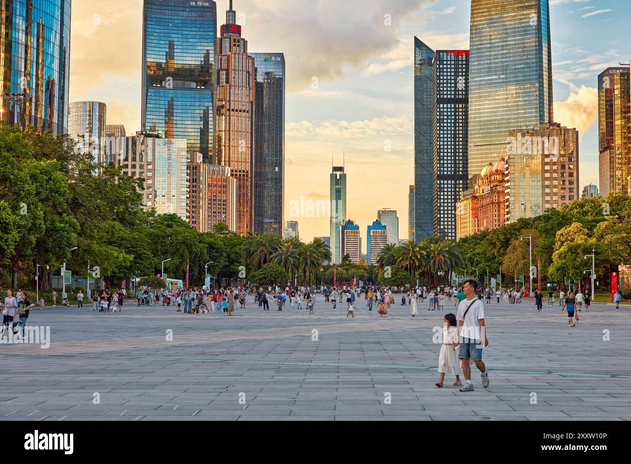 People walk in the Huacheng Square surrounded by modern high-rise ...