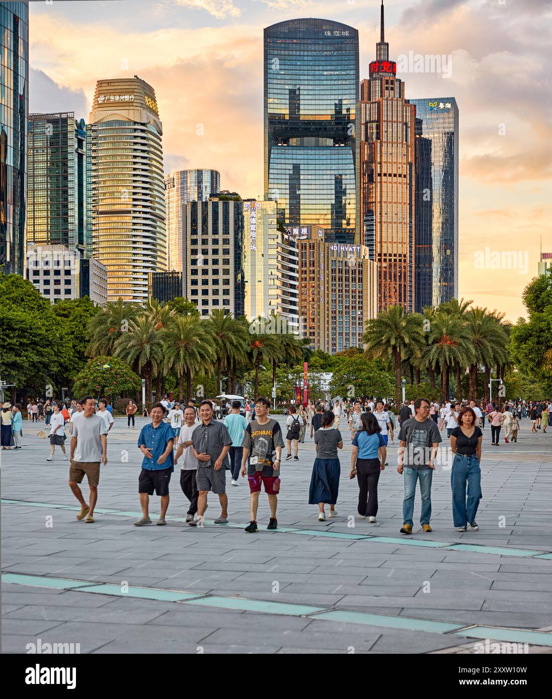 People walk in the Huacheng Square surrounded by modern high-rise ...