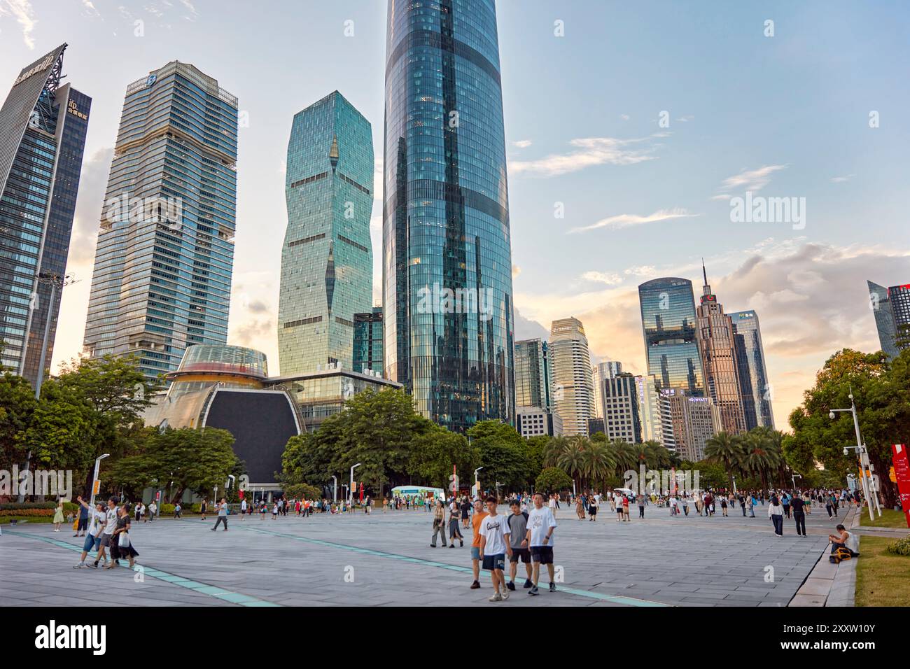 People walk in the Huacheng Square surrounded by modern high-rise ...