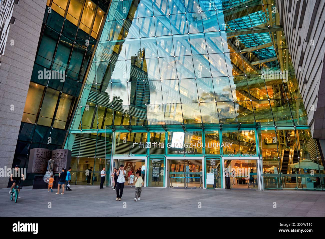 Glass facade and entrance gate of the Guangzhou Library building ...