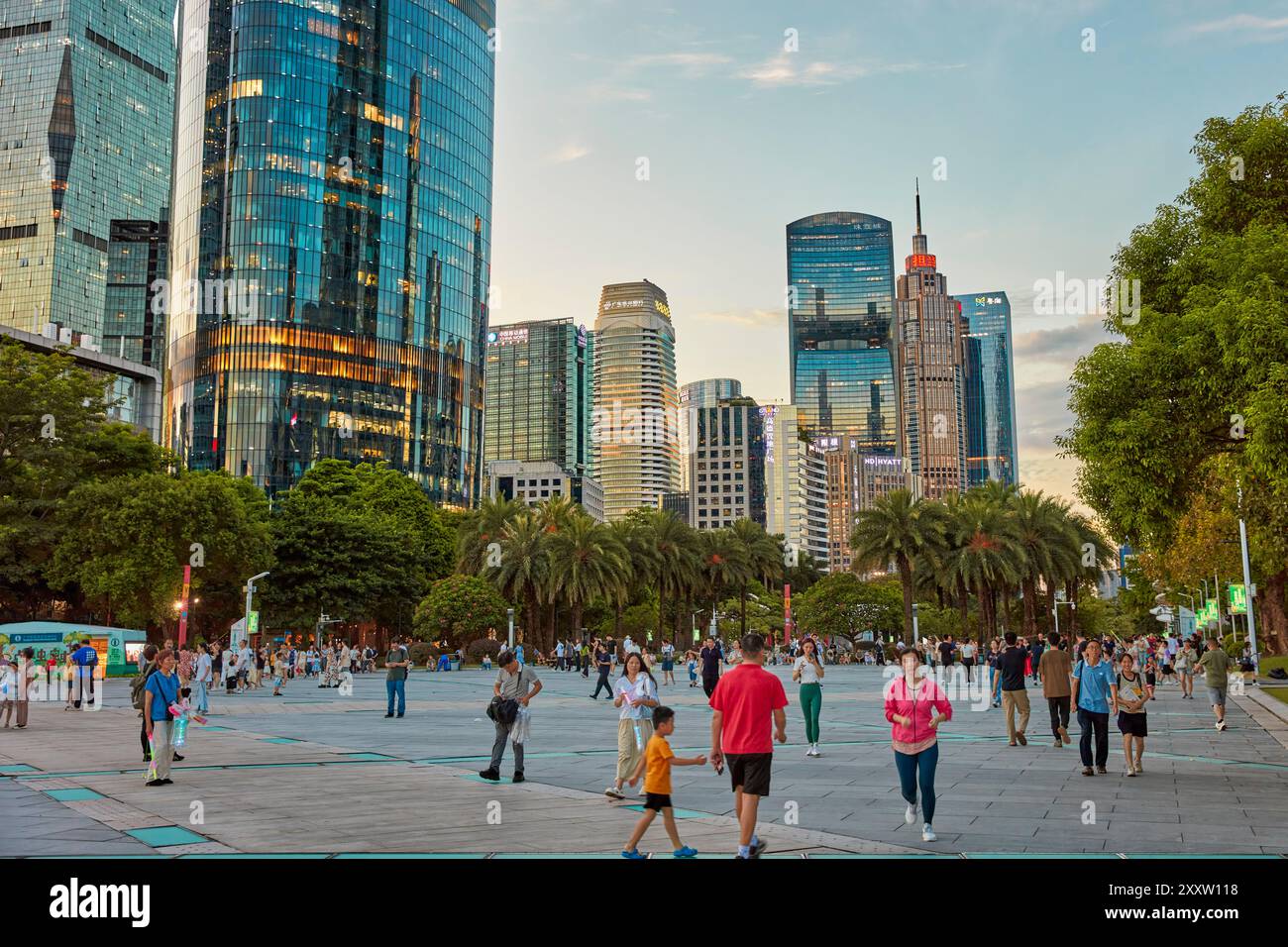 People walk in the Huacheng Square surrounded by modern high-rise ...