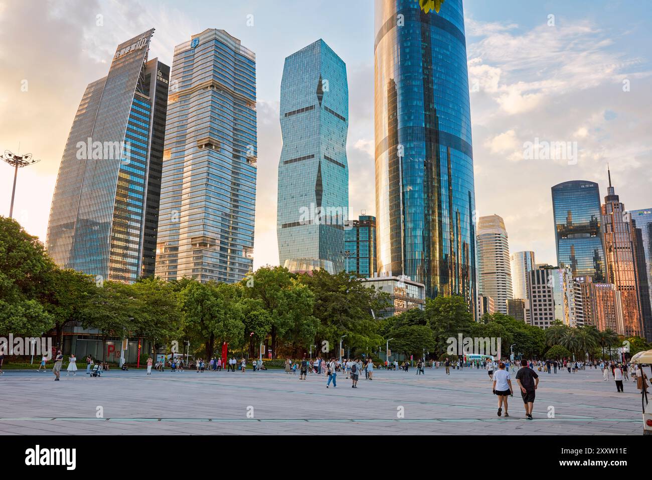 People walk in the Huacheng Square surrounded by modern high-rise ...