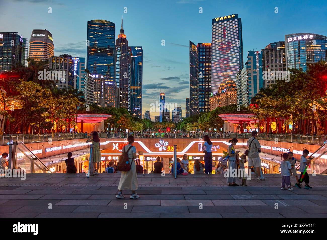Modern high-rise buildings at the Huacheng Square illuminated at dusk ...