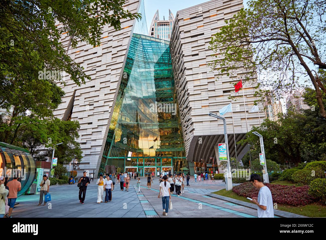 People walk at the entrance to the Guangzhou Library. Guangzhou ...