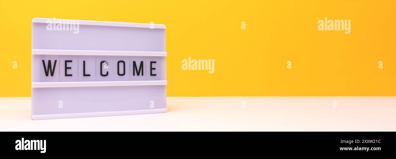 Word Welcome. Banner with lightbox in front of yellow background. Place ...
