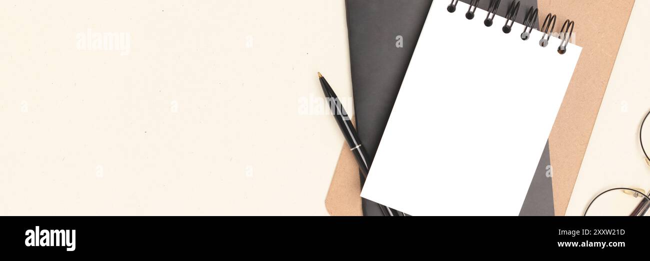 Banner with notepad mockup and pen on a beige background Stock Photo ...