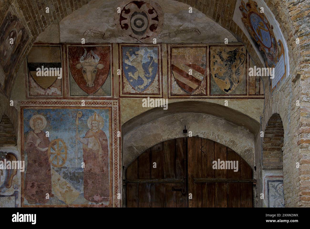 Heraldic devices and arms of medieval public officials above St ...