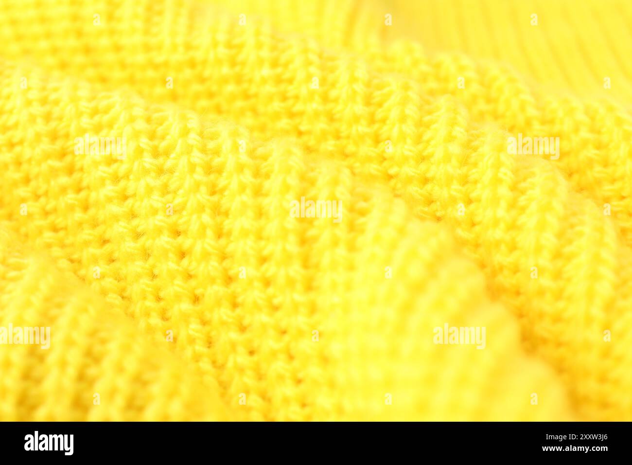 Texture of yellow knitted fabric as background, closeup Stock Photo - Alamy