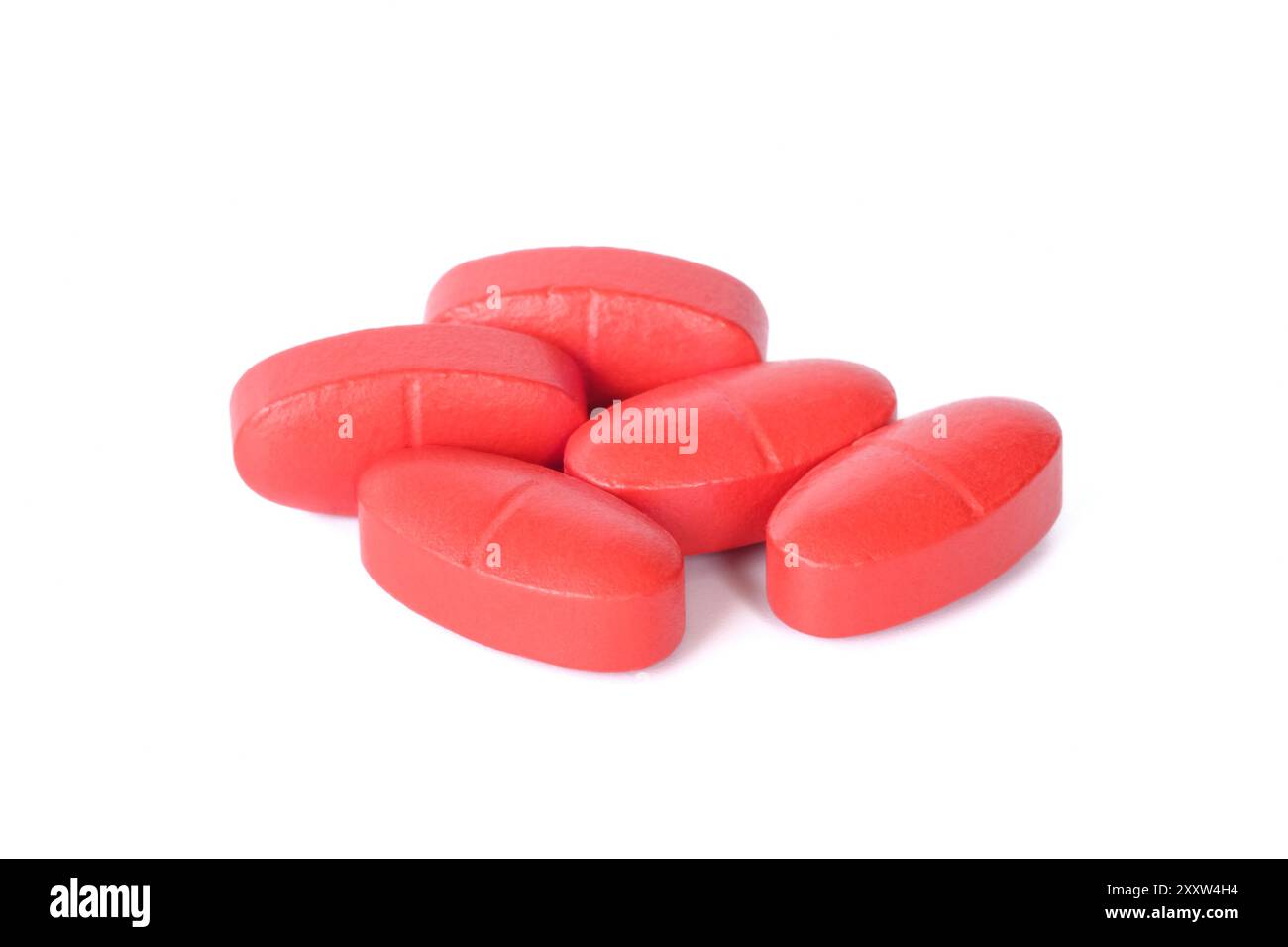 Red tablets oral medication close up on white background Stock Photo ...
