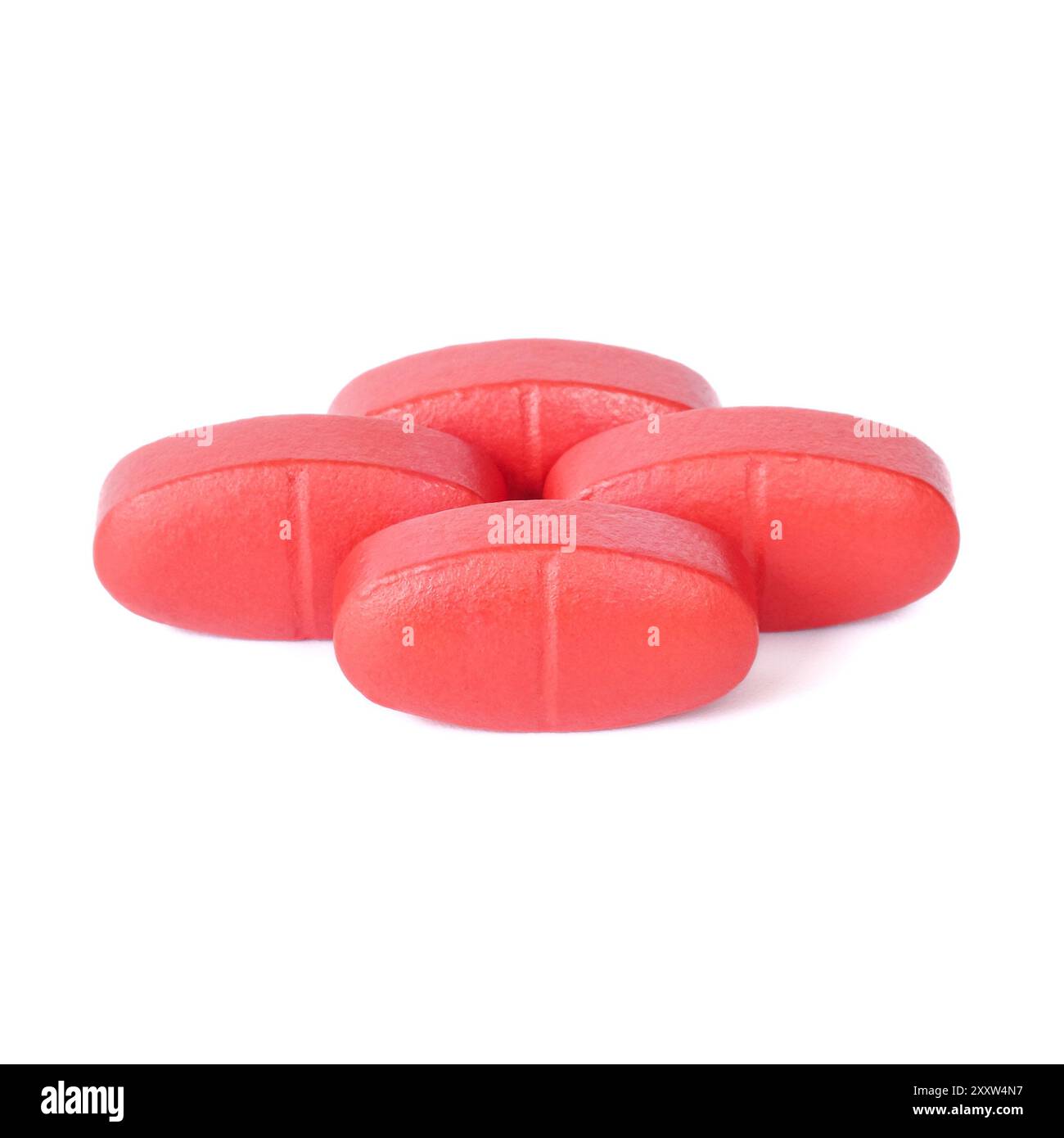 Red oral medication tablets close up on white background Stock Photo ...