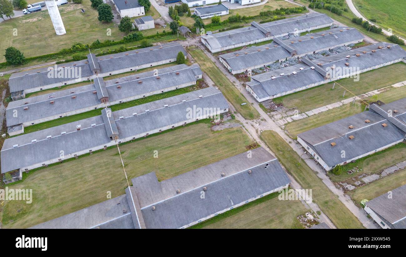 Drone photography of an old indoor chicken factory during summer cloudy ...