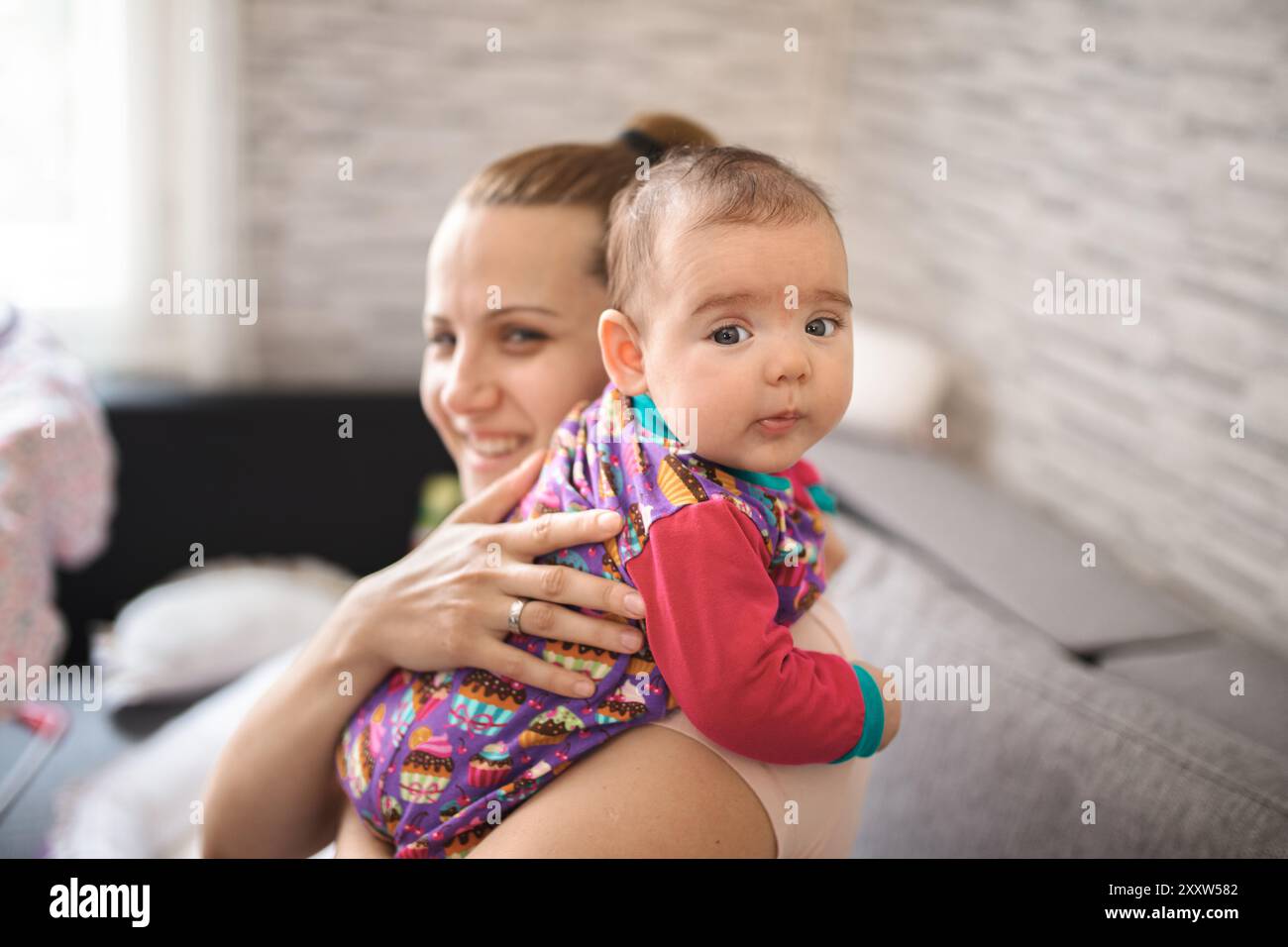 Caring mother breastfeeding newborn hi-res stock photography and images ...