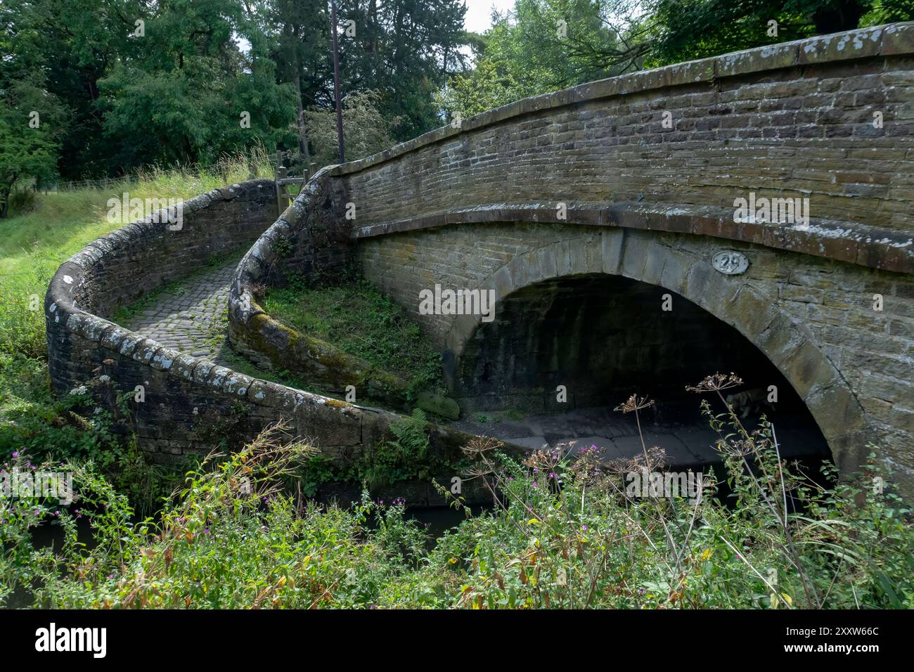 A 19th century spiral bridge spanning the Macclesfield Canal at ...