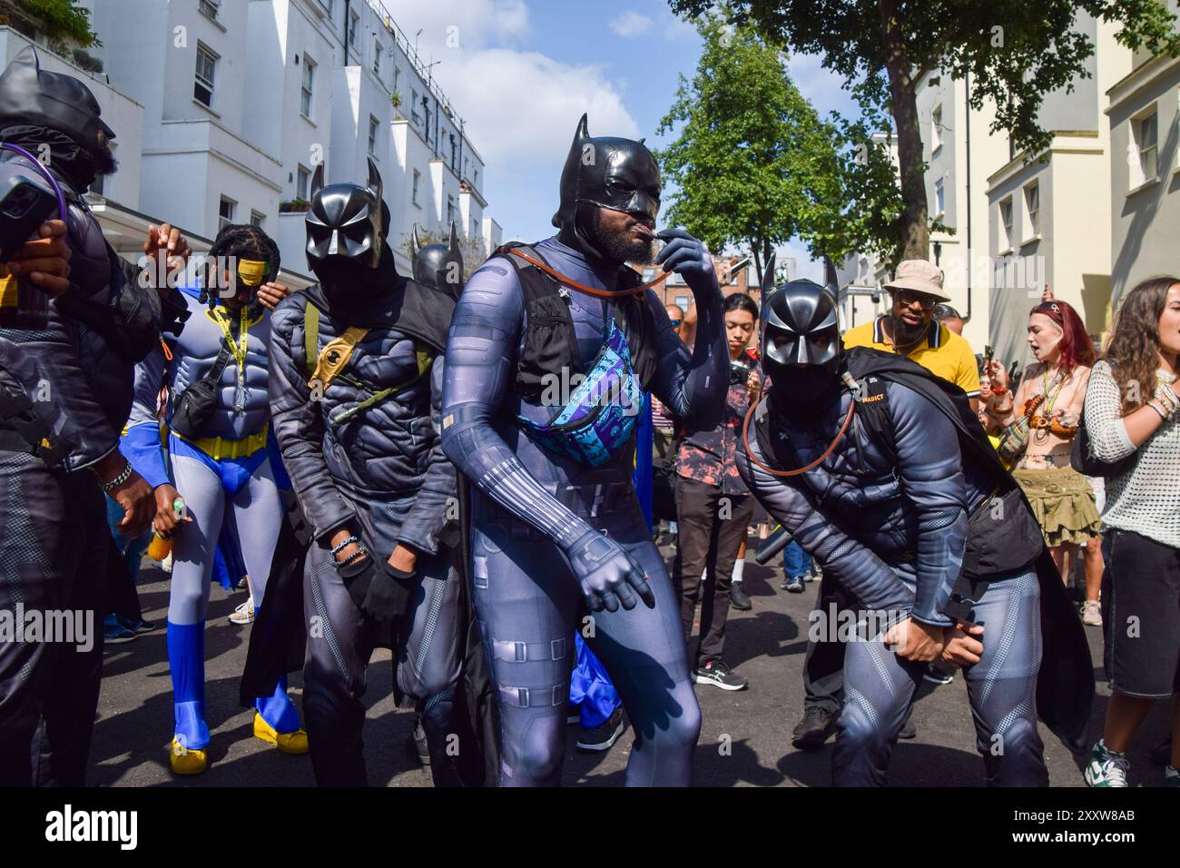 London, England, UK. 26th Aug, 2024. Revellers dressed as Batmen take ...