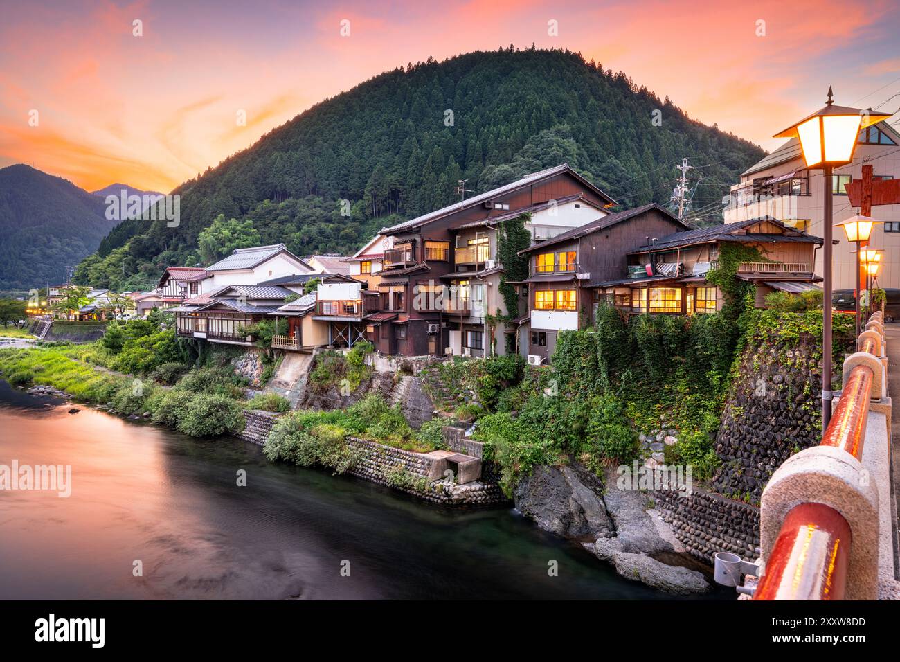 Gujo Hachiman, Japan hot springs town at dusk over the Yoshida River ...