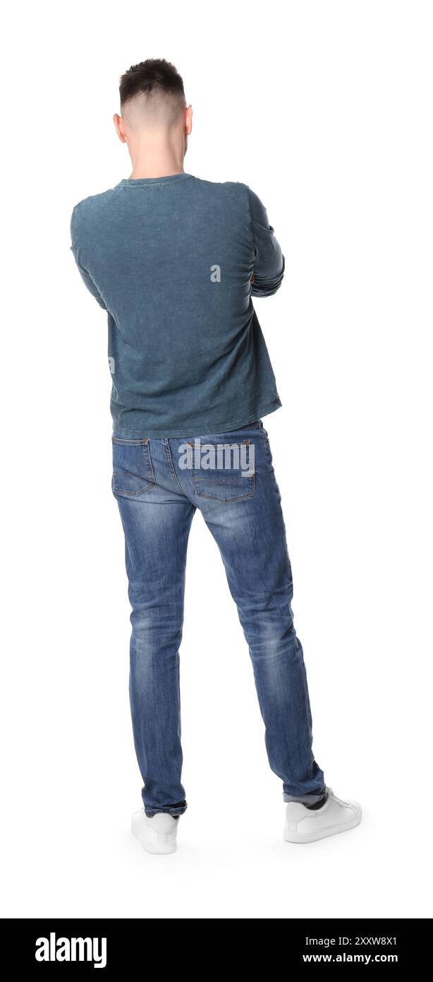 Man standing in queue on white background, back view Stock Photo - Alamy