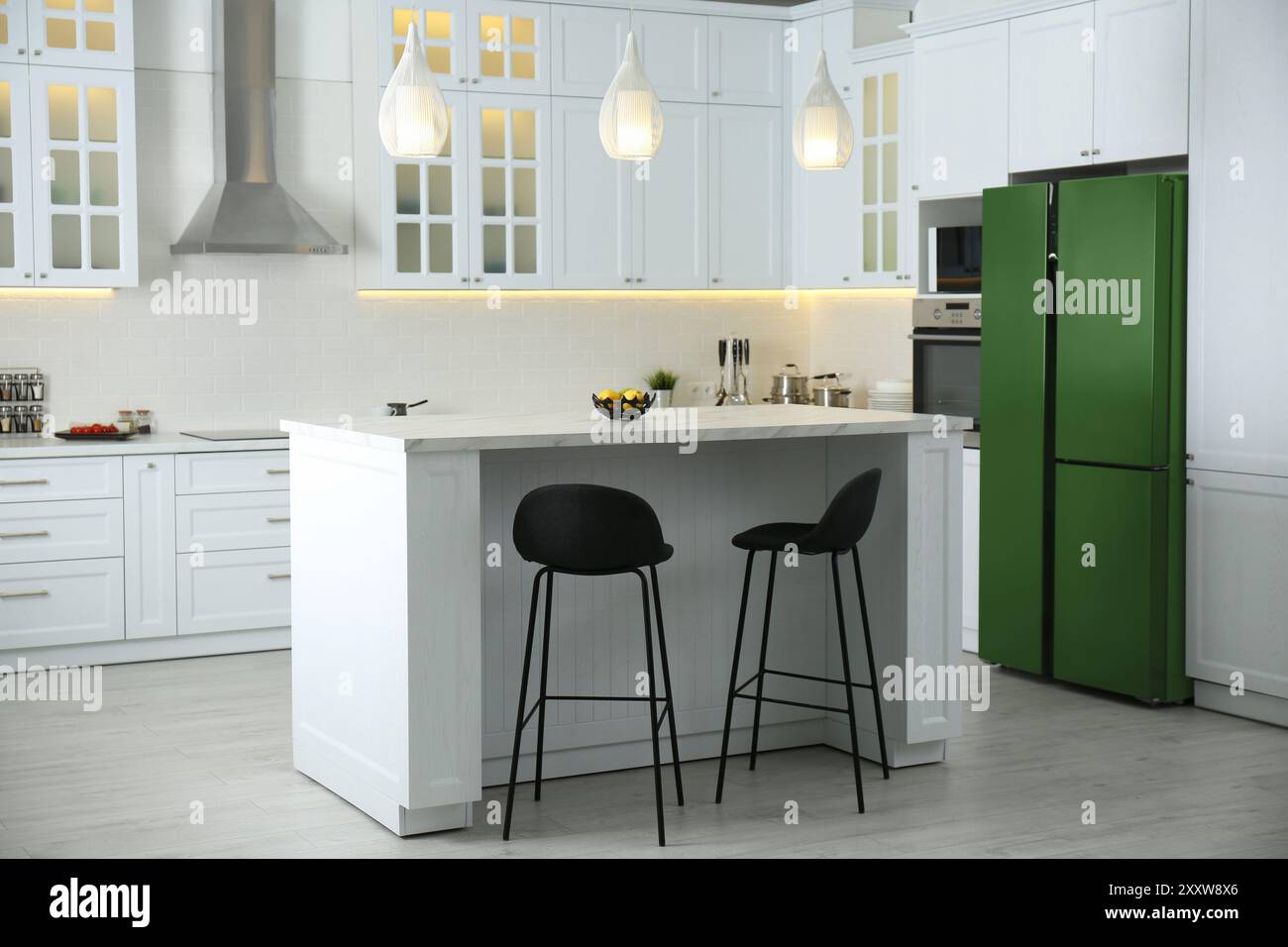 Green refrigerator in kitchen. Bright color accent in interior Stock ...