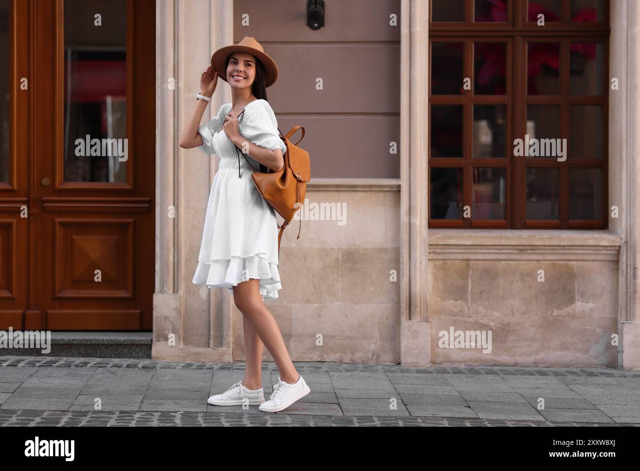 Trendy woman in hat backpack hi-res stock photography and images - Alamy