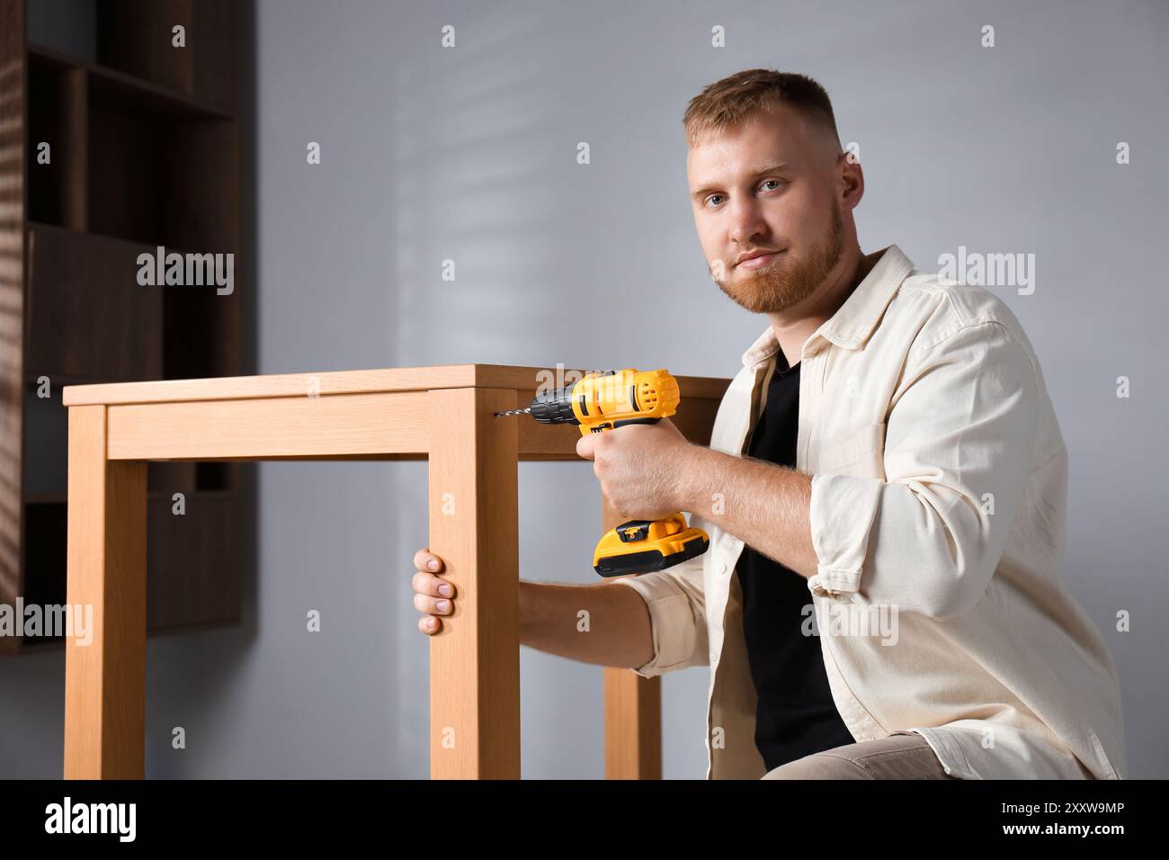 Young man drill assembling hi-res stock photography and images - Alamy