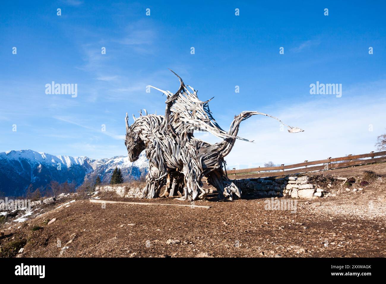 Wooden sculpture of a dragon made of tree branches. Vaia tempest dragon ...