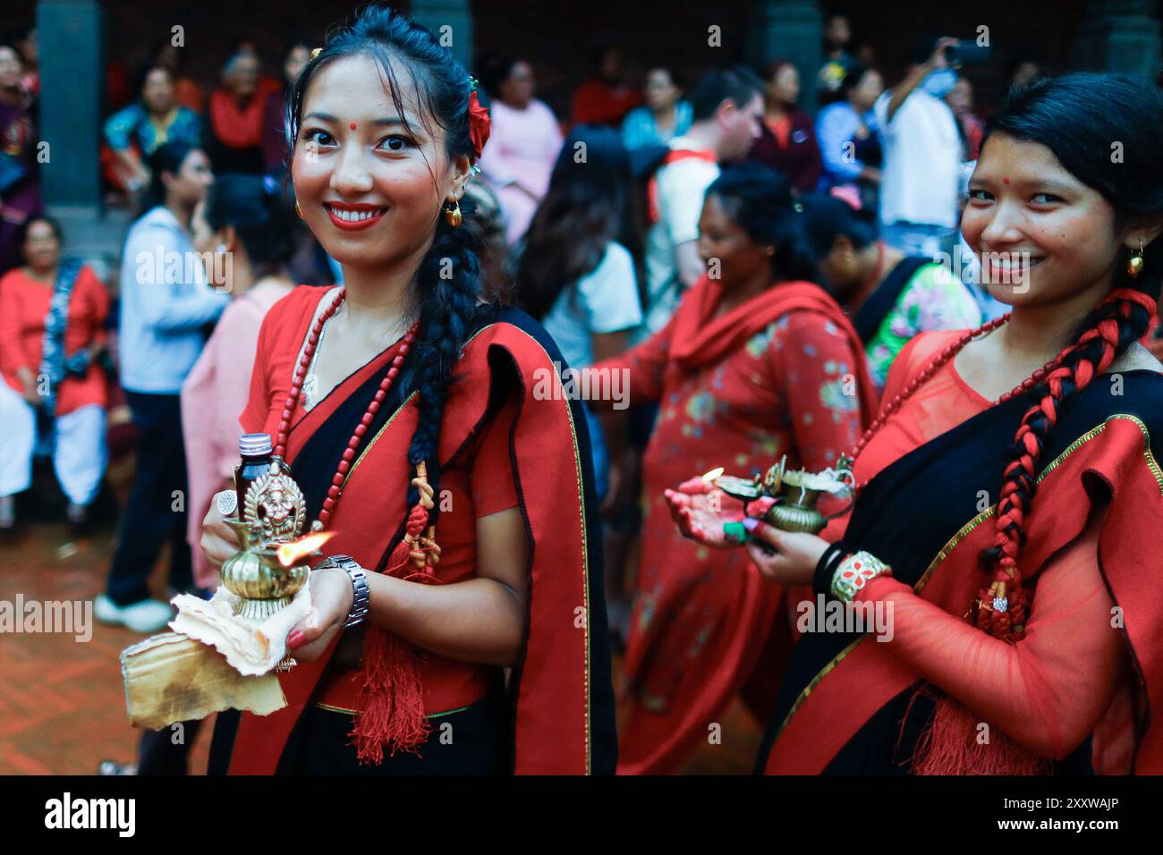 Bhaktapur, Nepal. 26th Aug, 2024. Devotees with lamps and incense ...