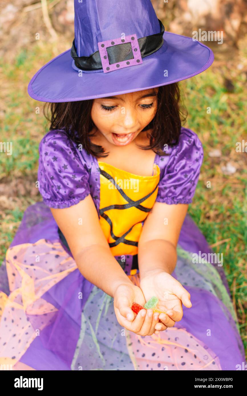 Girl taking candy Stock Photo - Alamy