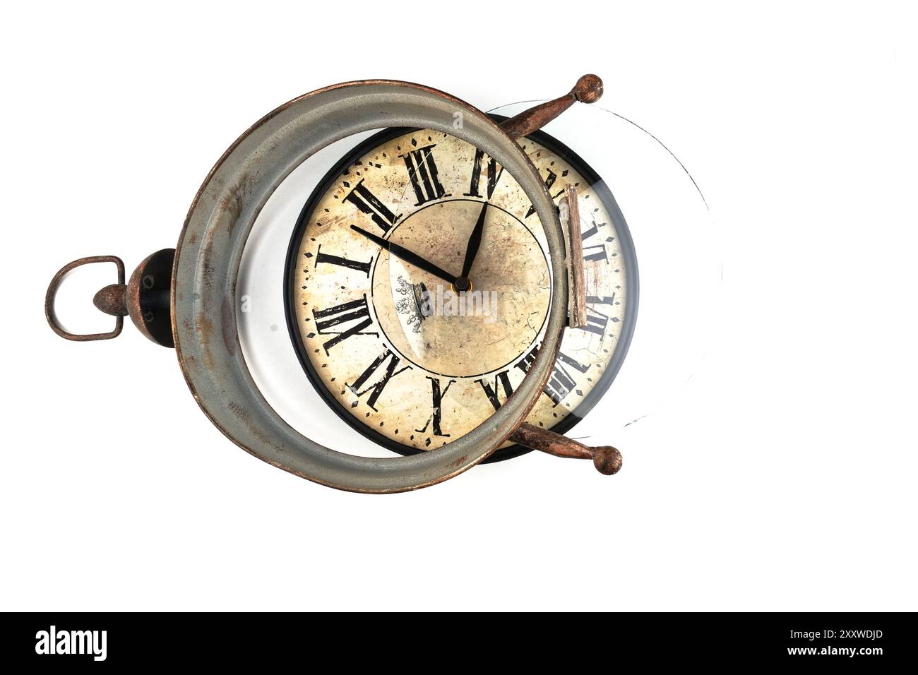 Broken old analog clock with glass and metal frame on wooden table ...