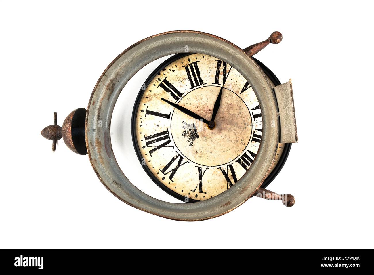Broken old analog clock with glass and metal frame on wooden table ...
