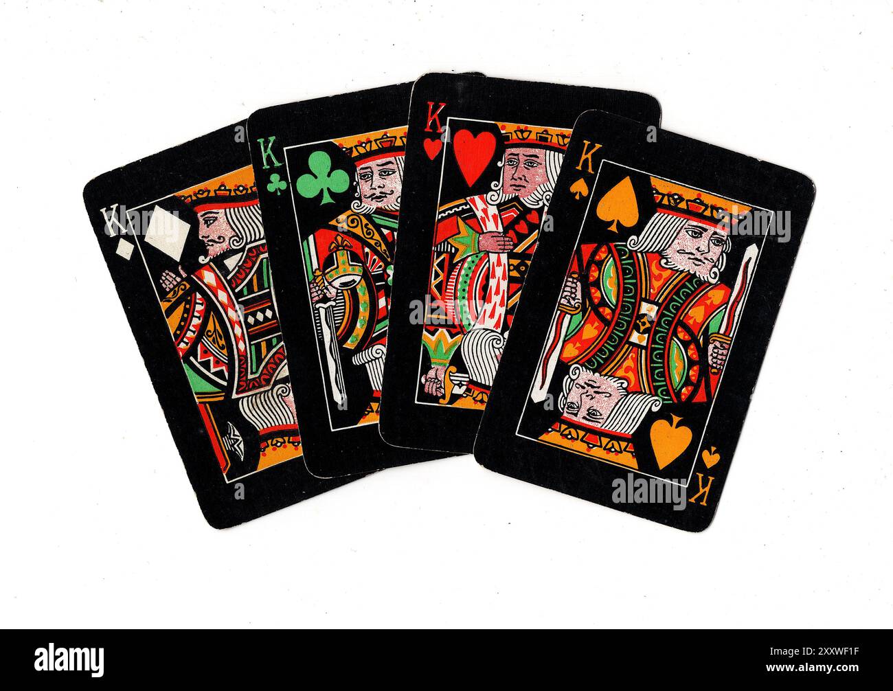 Vintage black playing cards showing four kings on a white background ...