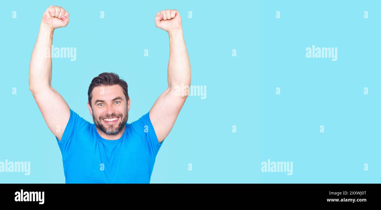 The winner. Successful man raising arms. Excited man with arms up ...