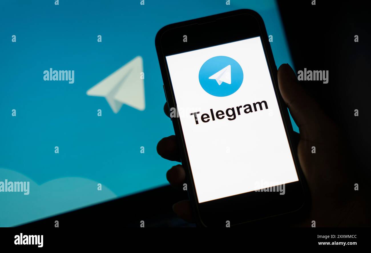 The Telegram messenger logo is being displayed on a smartphone screen ...