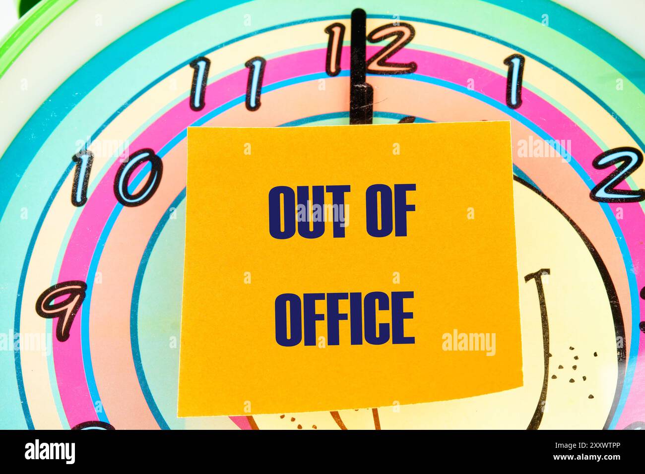 OUT OF OFFICE words written on the sticker on the background of the ...