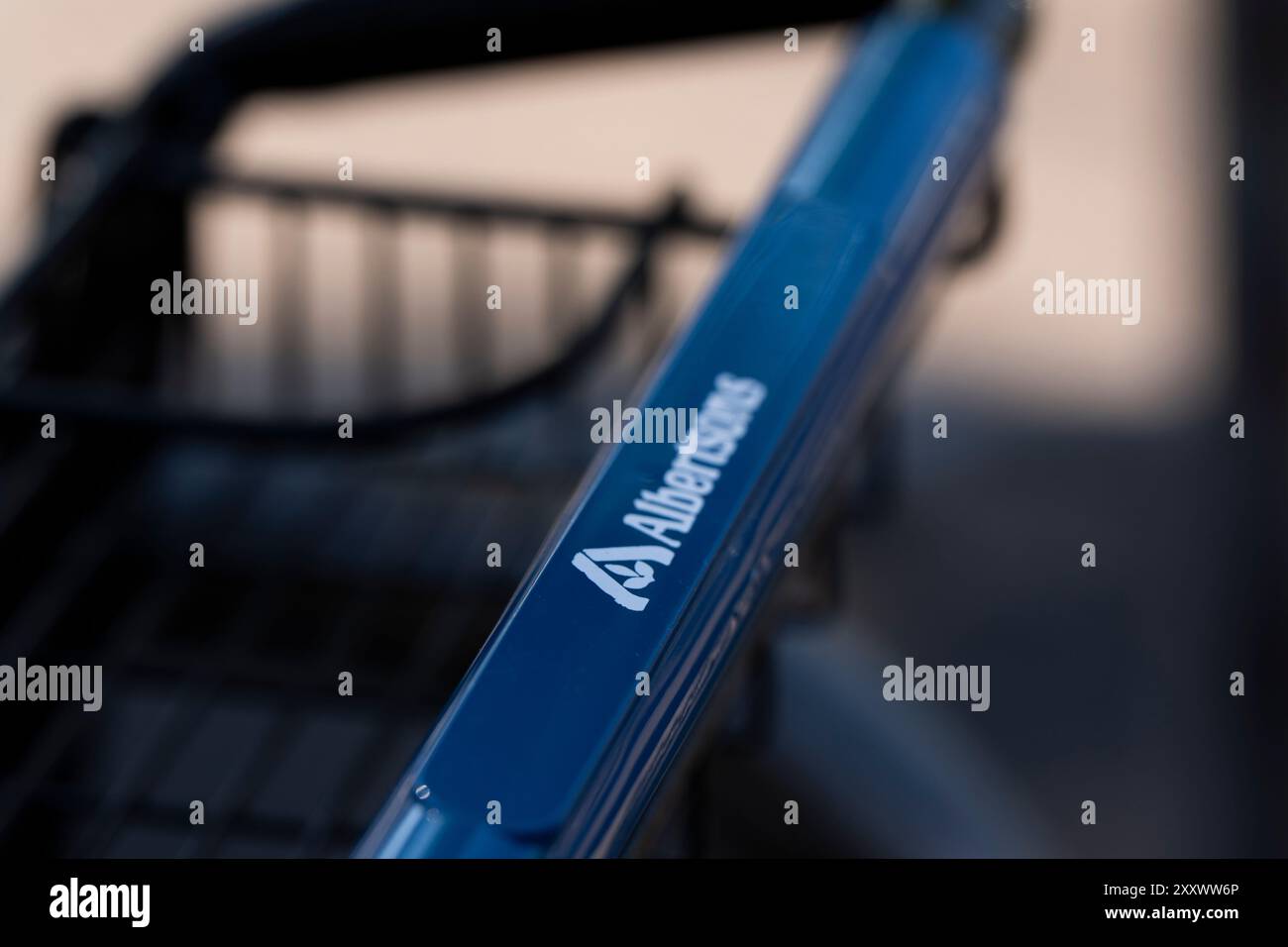 A sign for Albertsons grocery store is seen on a shopping cart on ...