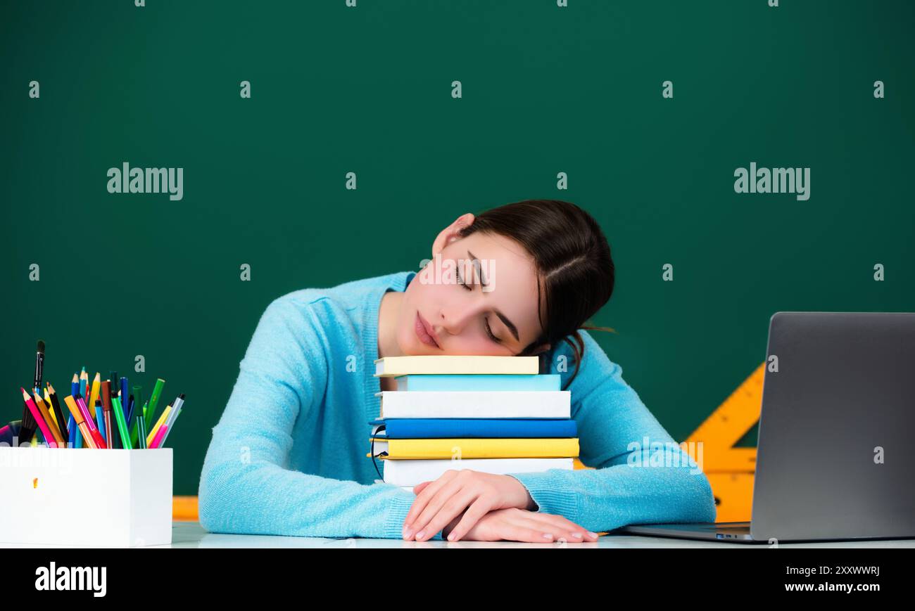Student sleeping during a lecture in a classroom. Portrait of tired ...