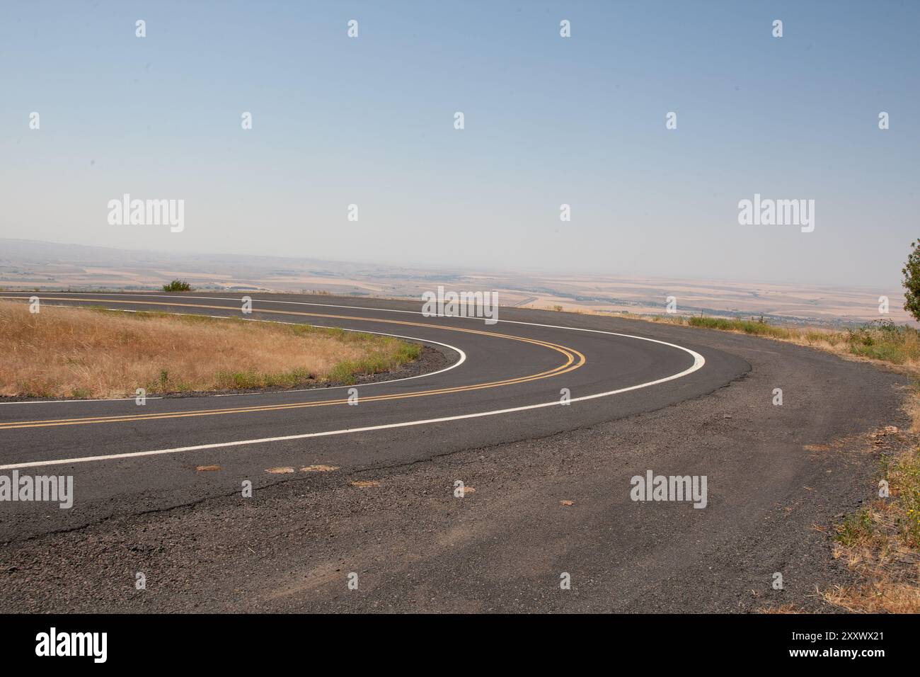 A winding road meanders through Pendleton, Oregon, tracing the contours ...